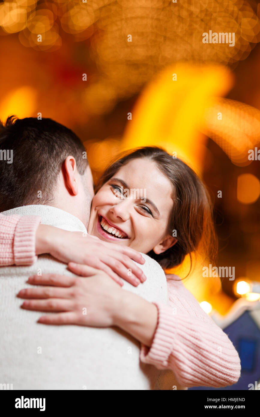 Cute couple hugging arms hi-res stock photography and images - Alamy