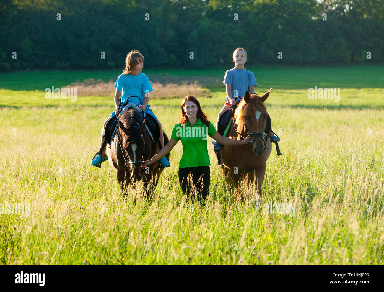 Two Boys Riding Horses Stock Photos & Two Boys Riding Horses Stock ...