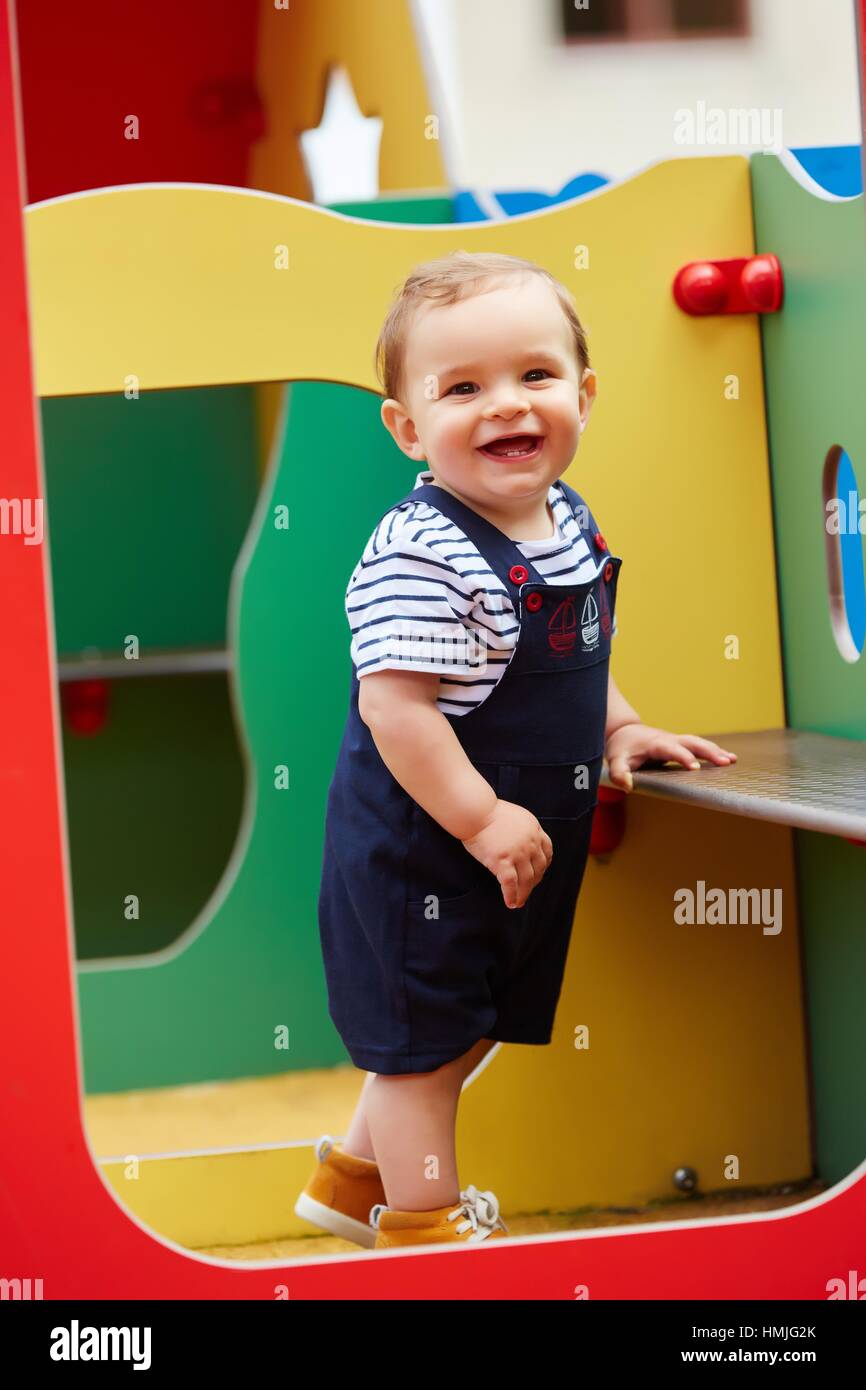 Baby on playground Stock Photo - Alamy
