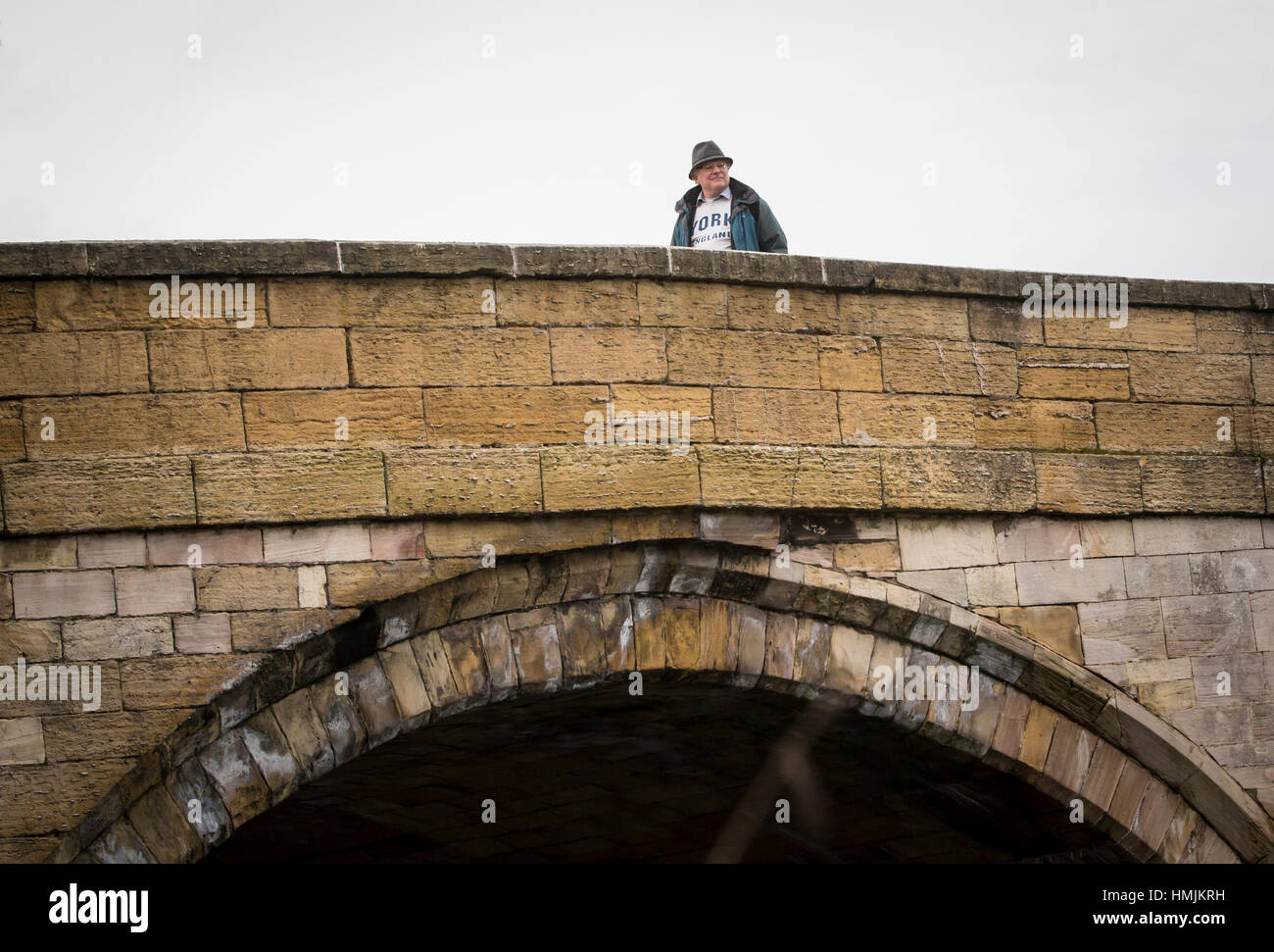 A member of the public crosses Tadcaster Bridge as it reopens more than ...