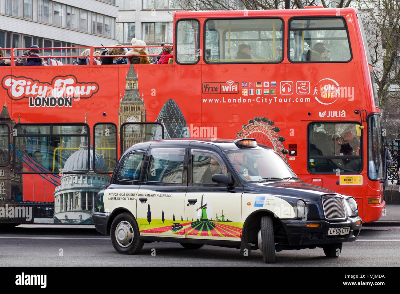 London sightseeing bus and black cab Stock Photo - Alamy
