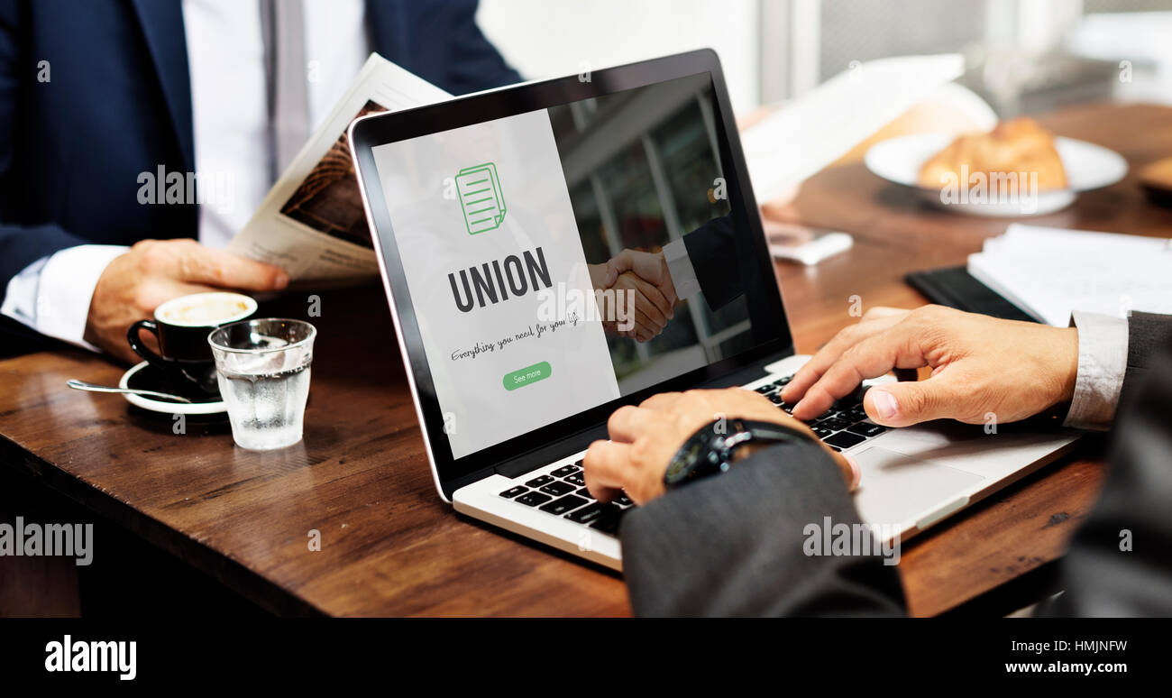 Union word on business handshake background Stock Photo - Alamy