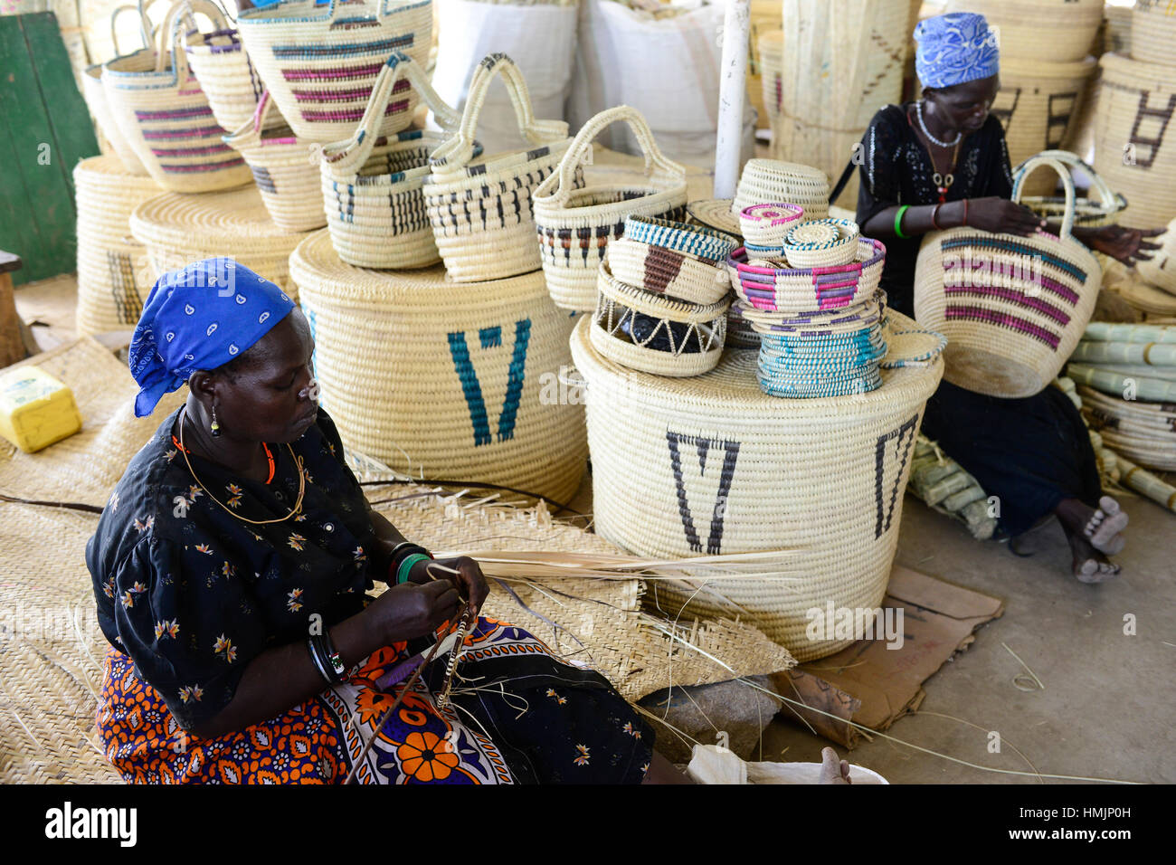 KENYA Turkana, Lodwar, women make baskets for sale at a craft market ...