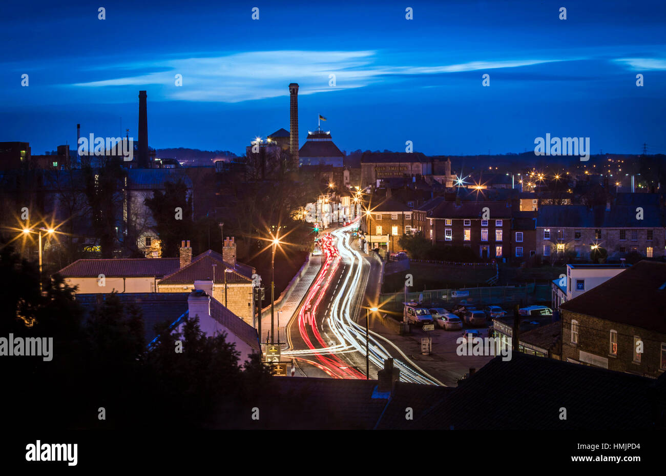 Cars travel across Tadcaster Bridge at night, as it reopens more than a ...