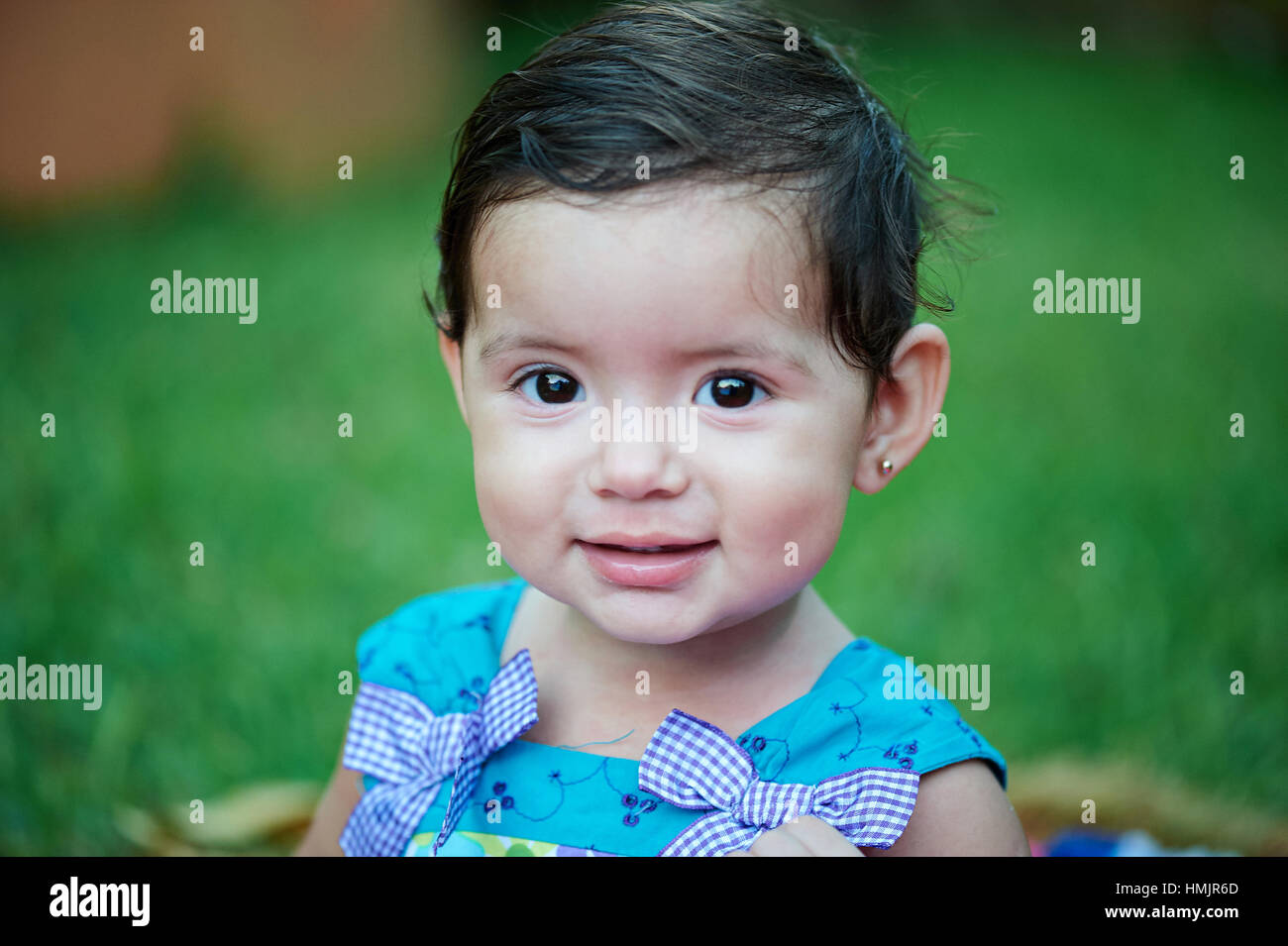 smiling little girl close up portrait in park Stock Photo - Alamy