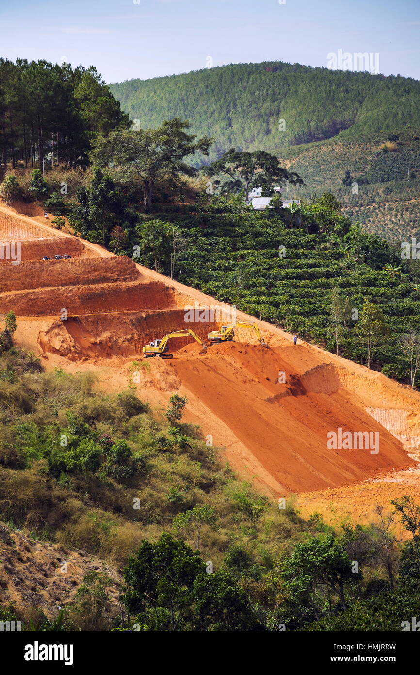 Diggers excavate terraces for coffee beans plantations in Vietnam Stock ...