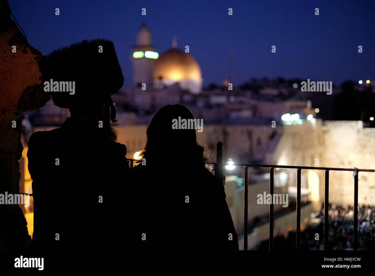 An ultra orthodox Jewish couple gazing at the Islamic shrine Dome of ...