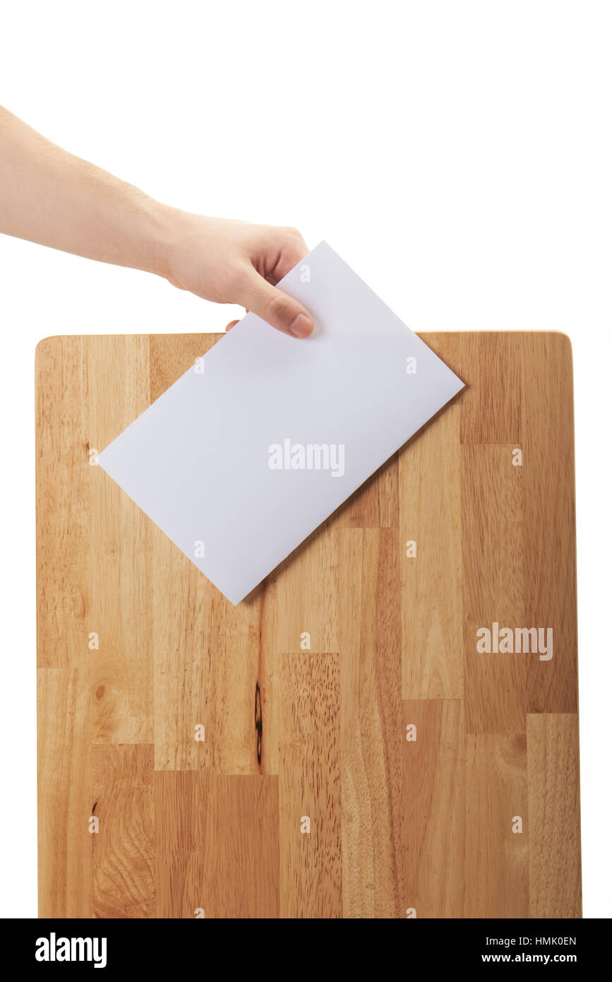 hand hold paper near wood box isolated on white Stock Photo - Alamy