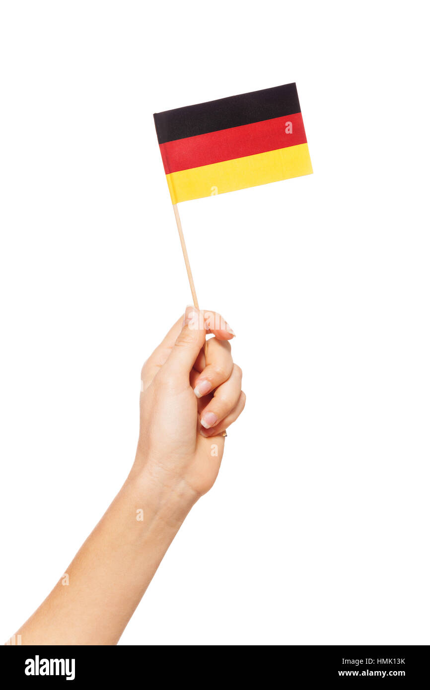 Woman's hand waving and raising small German flag Stock Photo - Alamy