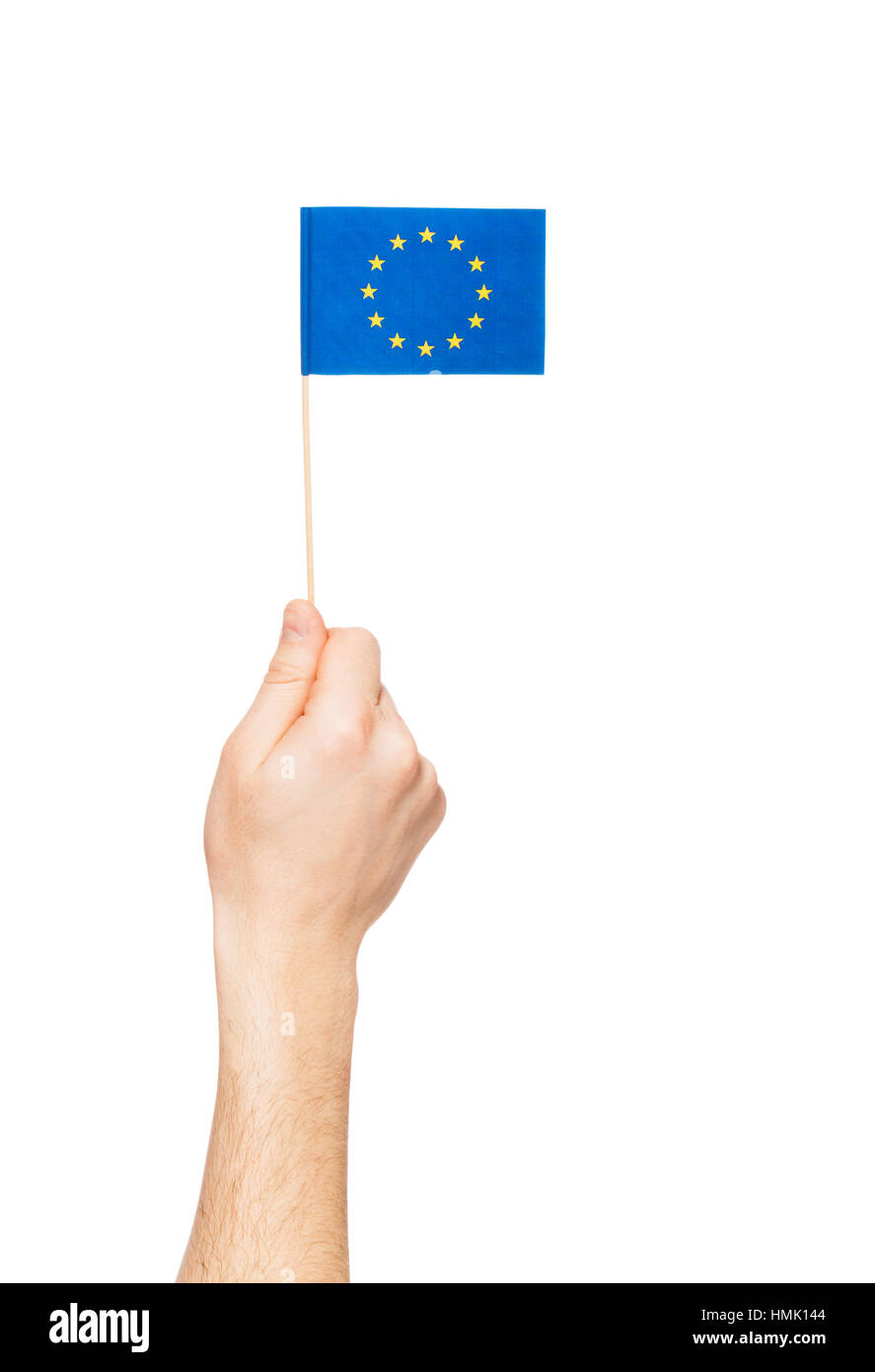 Man's hand holding and raising European Union flag Stock Photo - Alamy