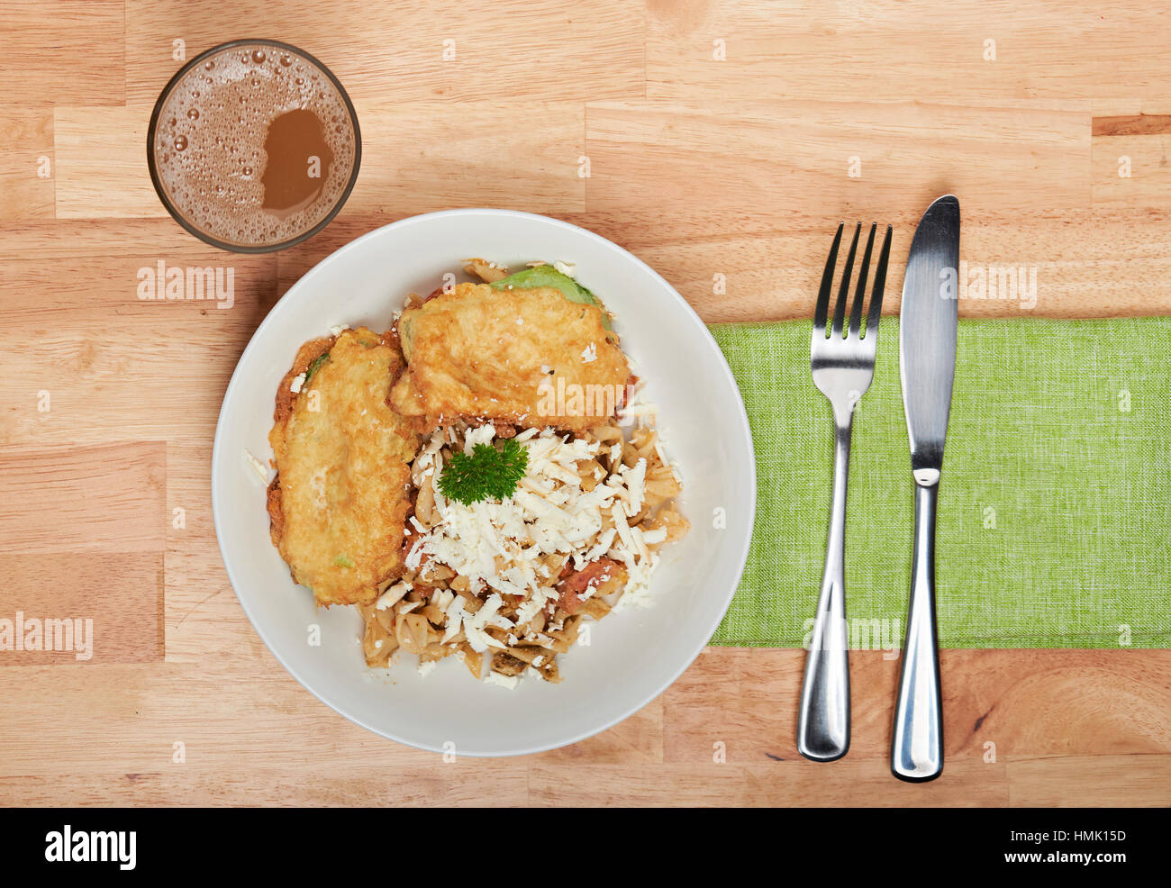 dinner of pasta and cheese juice on wood table Stock Photo - Alamy
