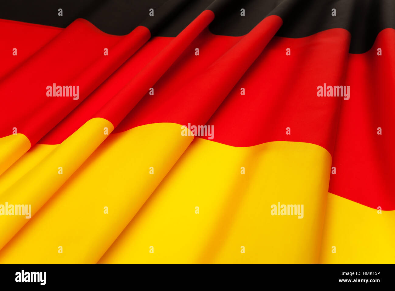 Textile pleated German flag laying on flatness Stock Photo - Alamy