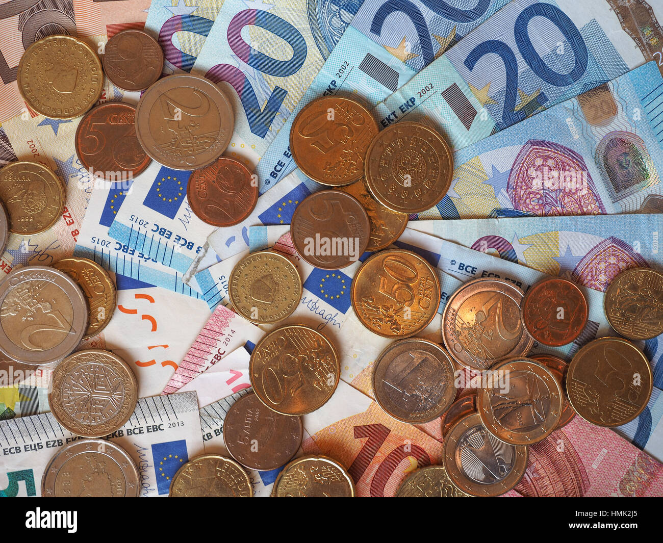 Euro (EUR) banknotes and coins, currency of European Union (EU) useful ...