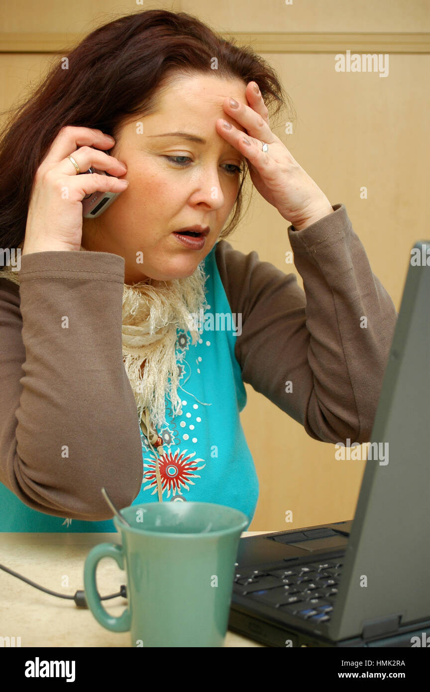 Stressed office clerk Stock Photo - Alamy