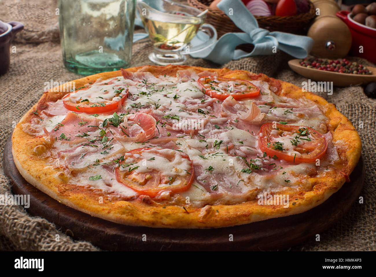 Pizza with ham cheese and tomatoes Stock Photo - Alamy