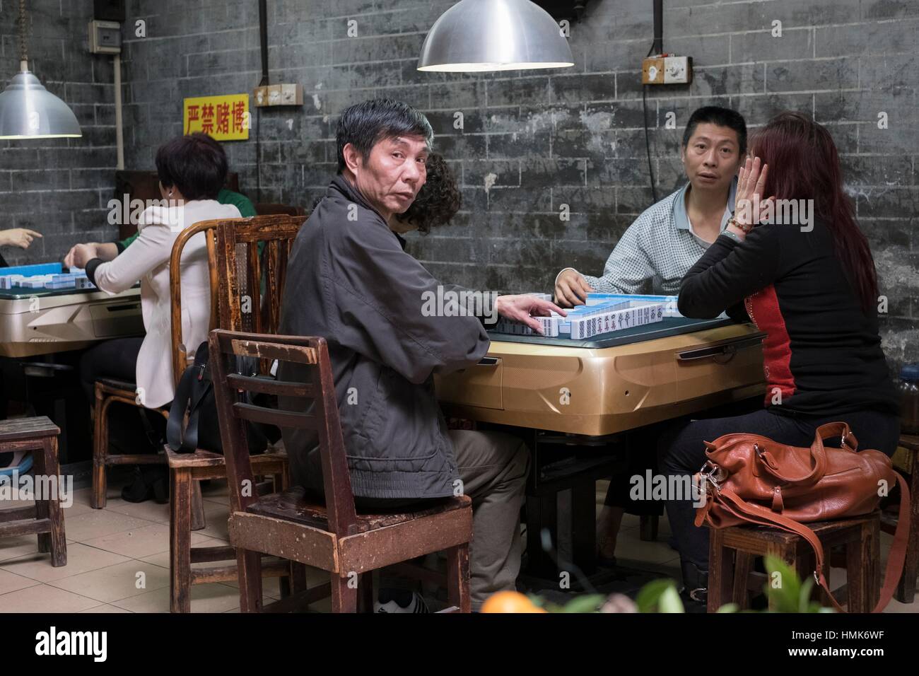 Woman playing mahjong hi-res stock photography and images - Alamy