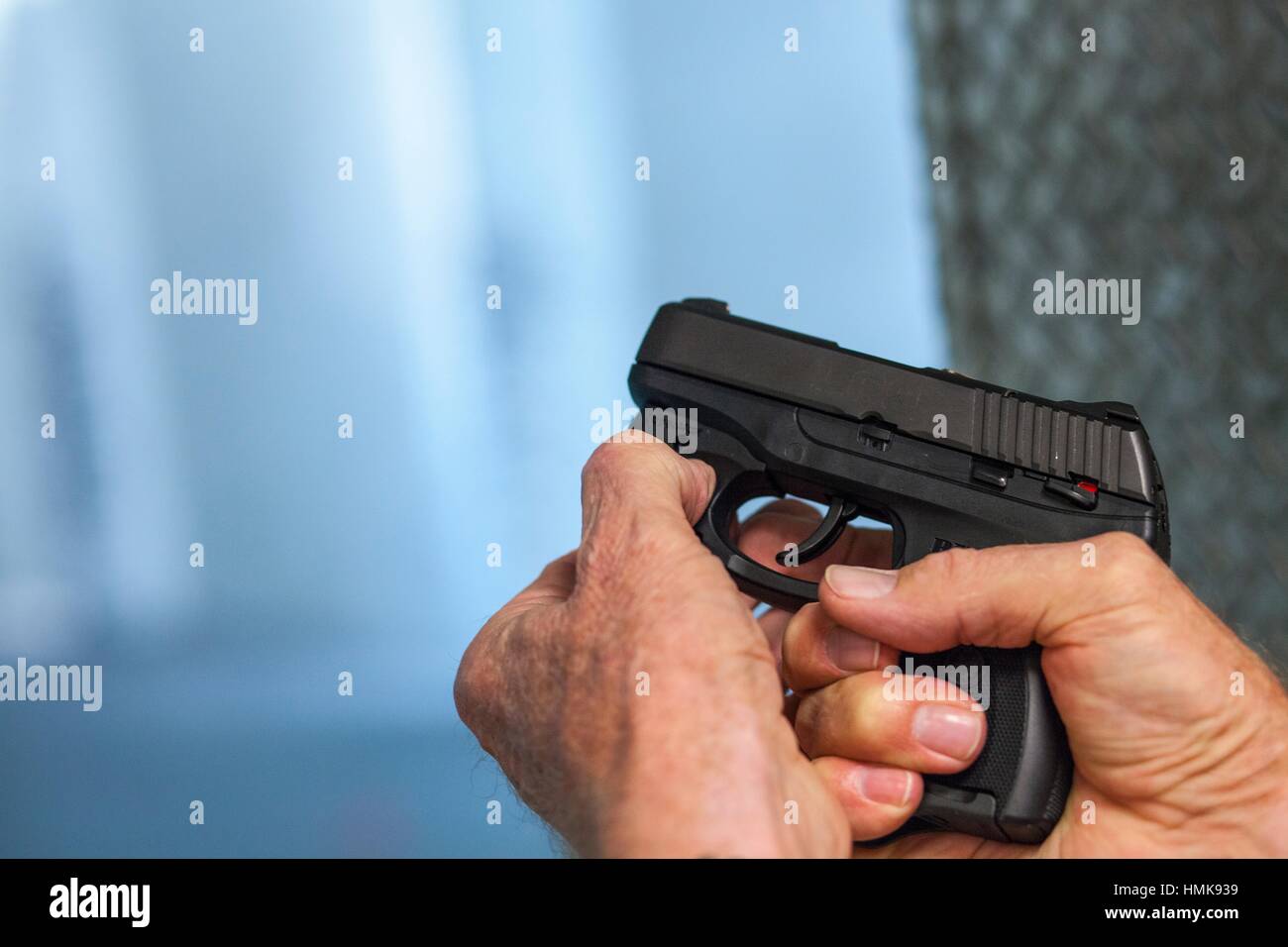 Shooting range. Loading a Ruger LC9 semi-automatic pistol Stock Photo ...