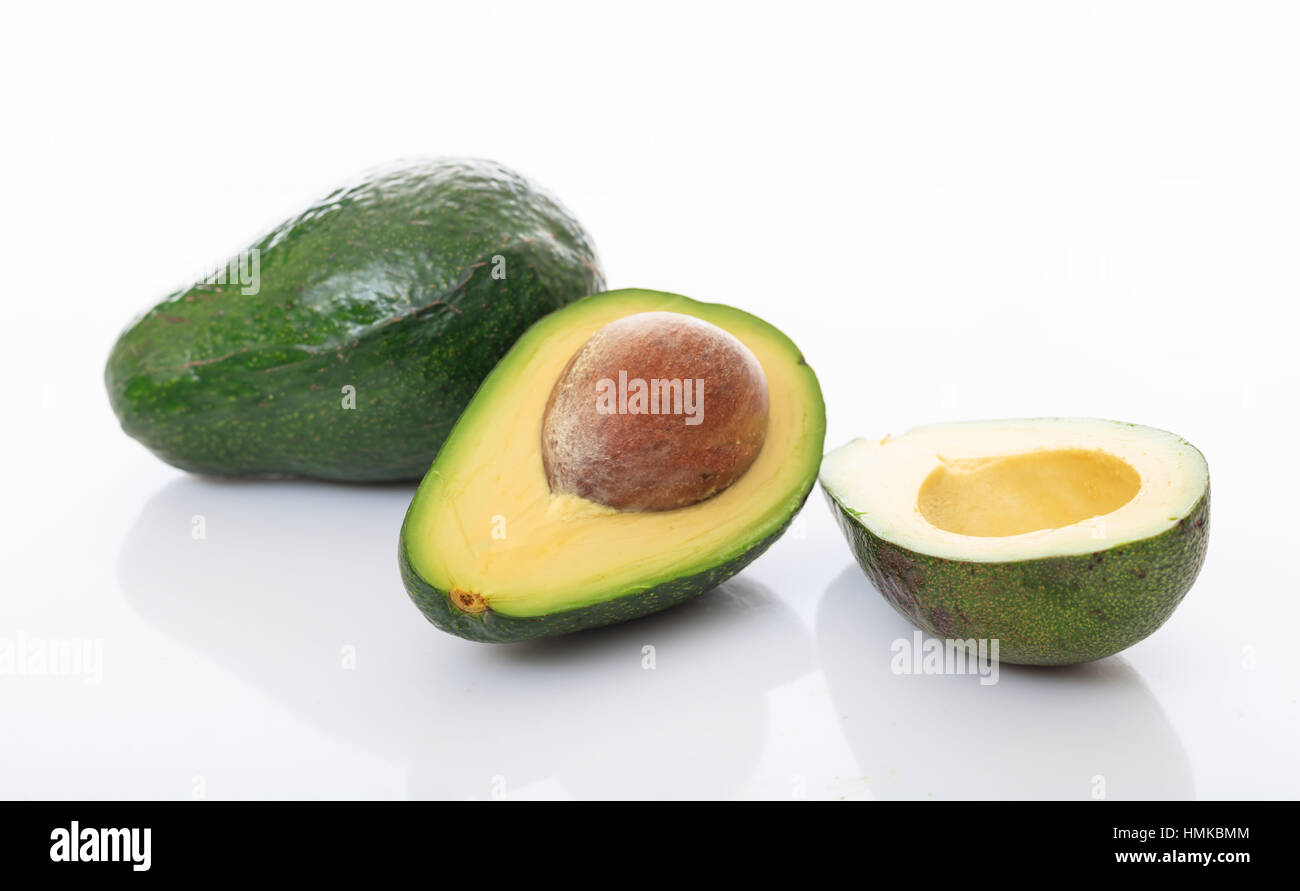 Avocados close up isolated on white background Stock Photo - Alamy