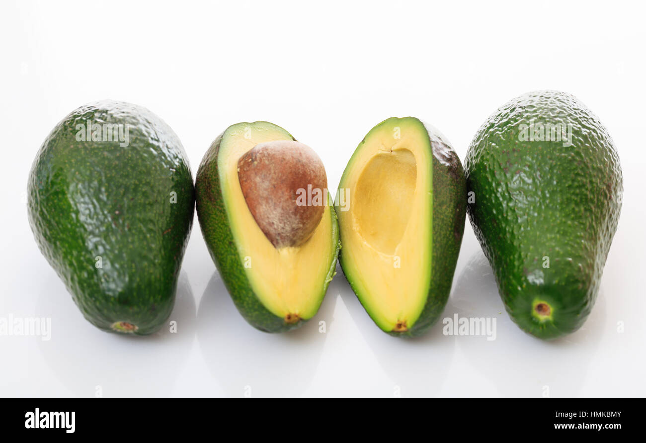 Avocados close up isolated on white background Stock Photo - Alamy