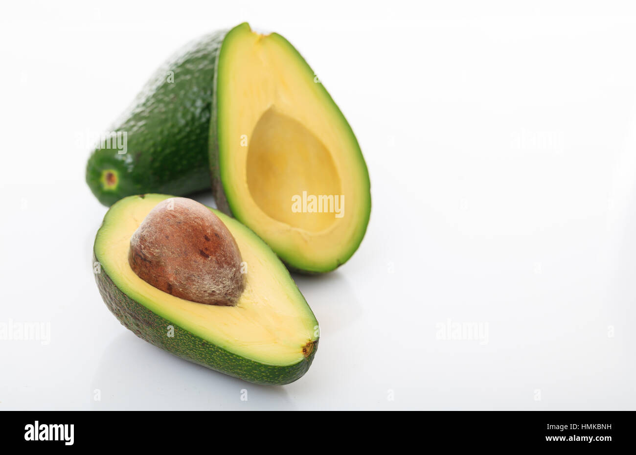 Avocados close up isolated on white background Stock Photo - Alamy