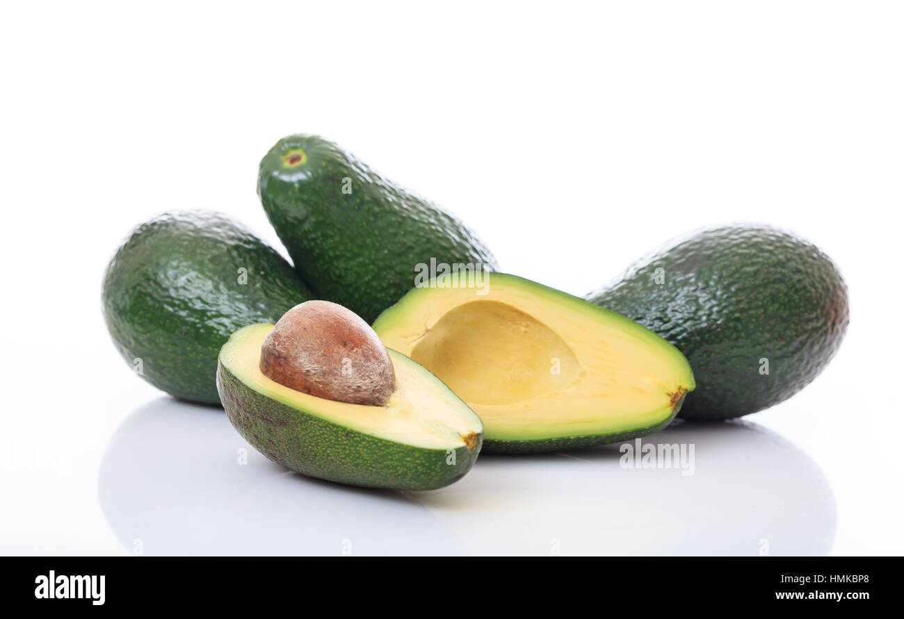 Avocados close up isolated on white background Stock Photo - Alamy