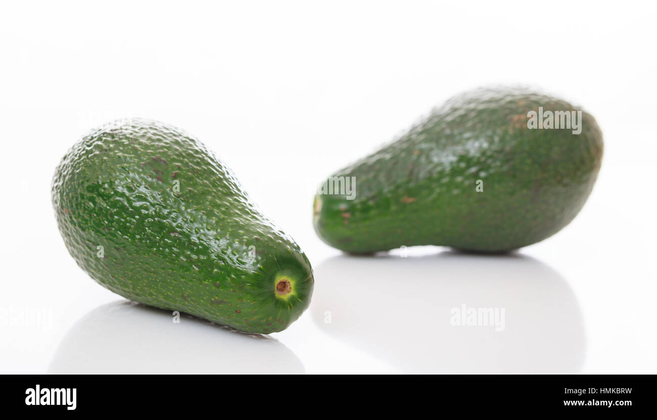 Two avocados isolated on white background Stock Photo - Alamy