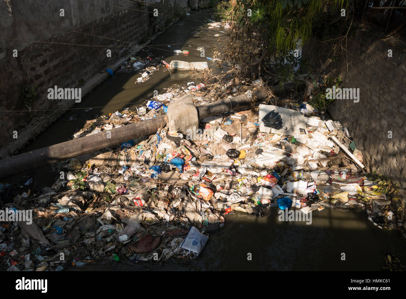 HYDERABAD, INDIA - FEBRUARY 03,2017 Sewage canal clogged by floating ...
