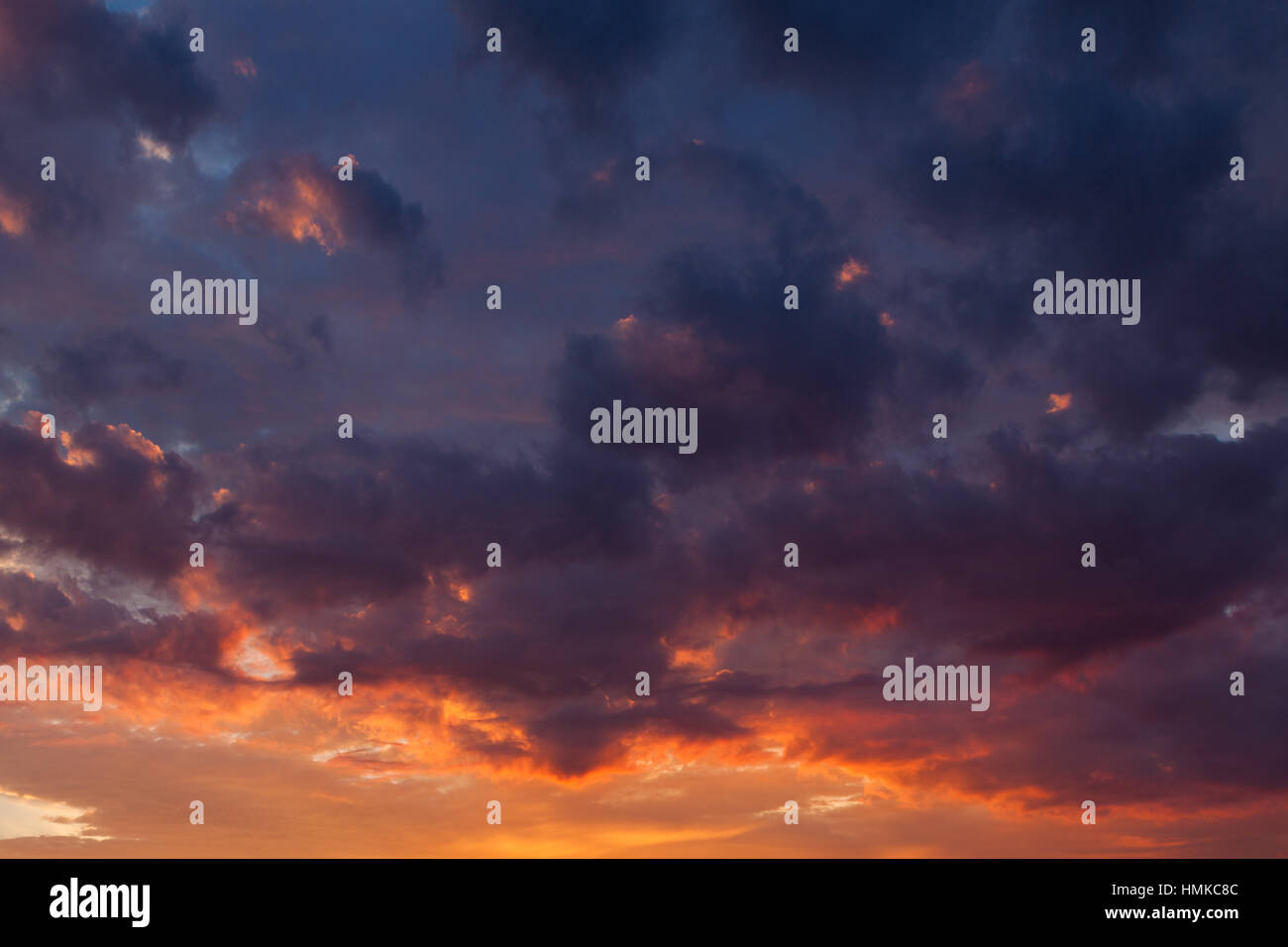 Fiery vivid sunset sky clouds Stock Photo - Alamy