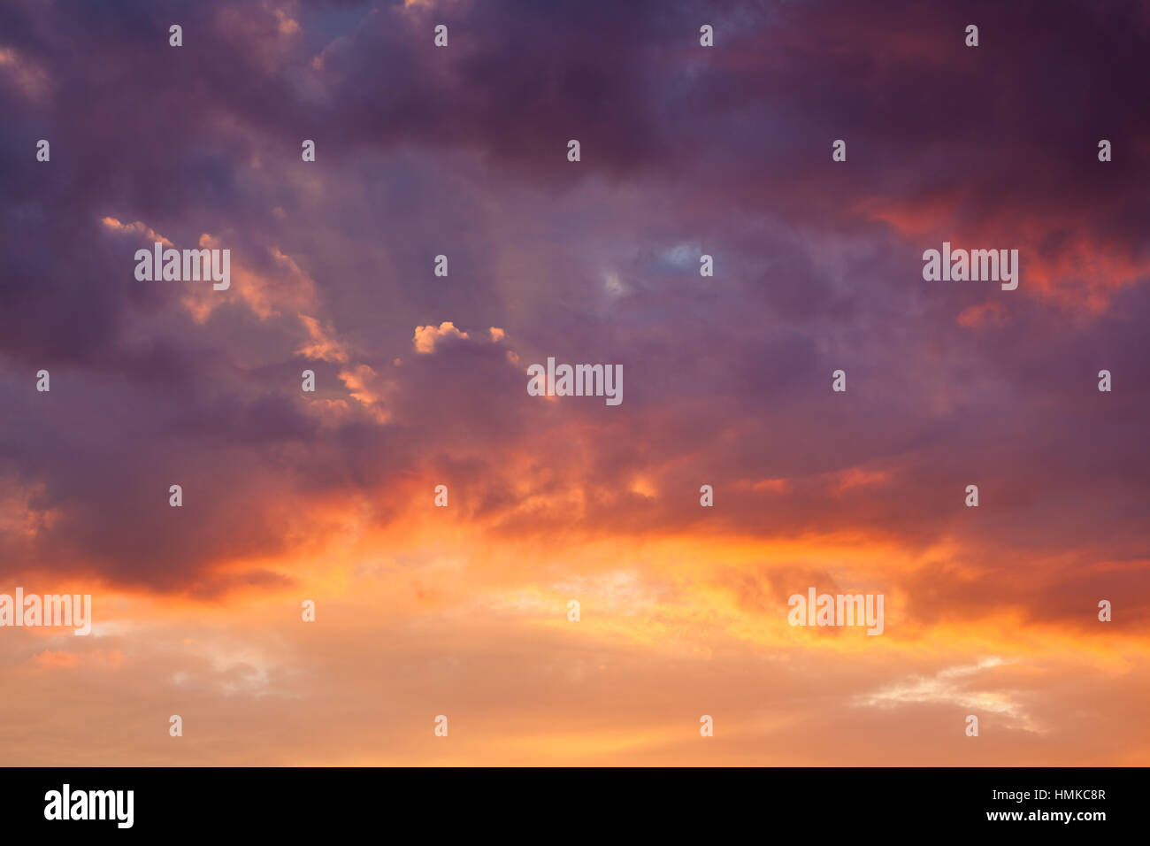 Fiery vivid sunset sky clouds Stock Photo - Alamy