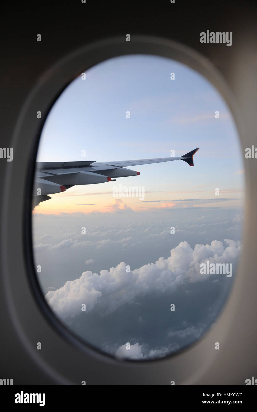 sunrise over Straits Singapore, window, wing winglet Airbus A380 flying ...
