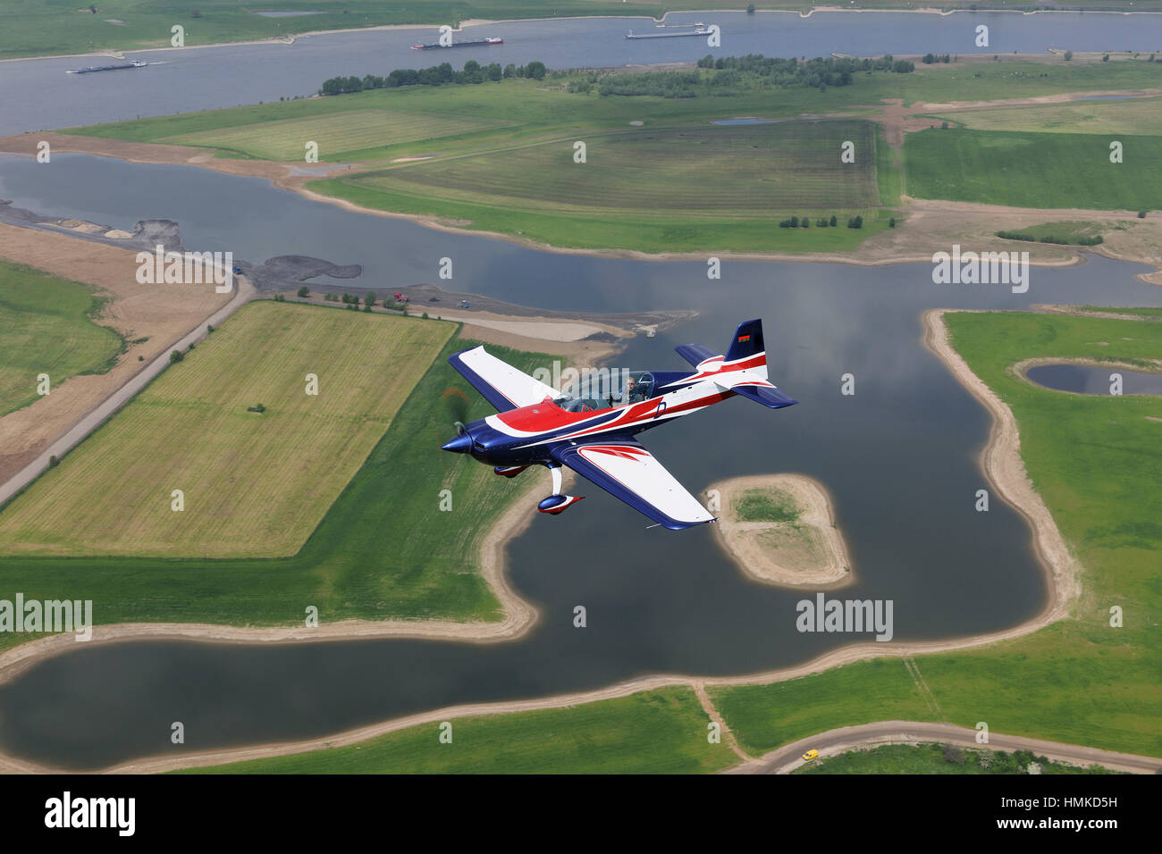 Doug Vayda flying the prototype Extra EA-330LT over the River Rhine in ...