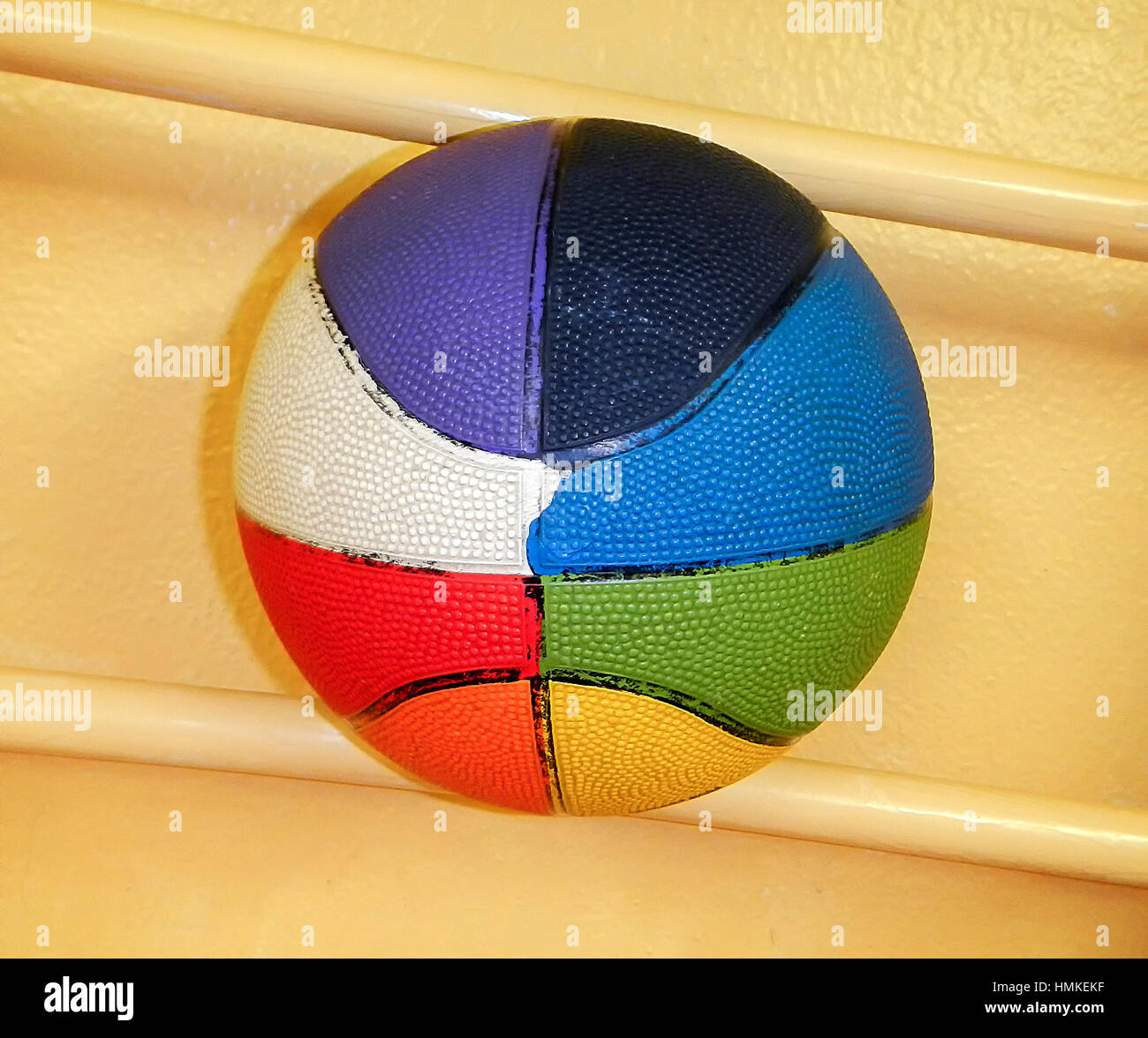 The multi and colored striped basketball old ball Stock Photo - Alamy