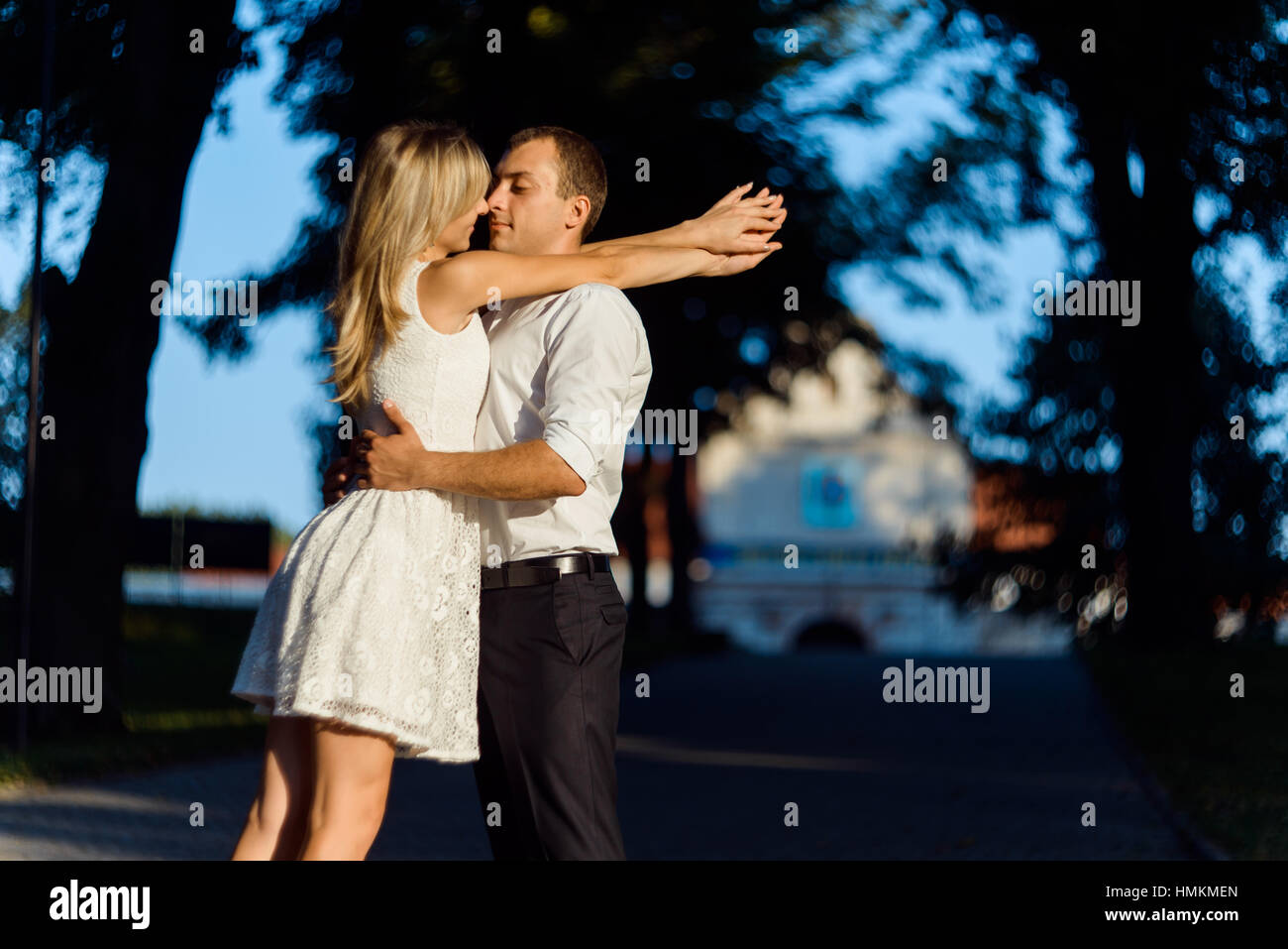 Young people embracing Stock Photo - Alamy