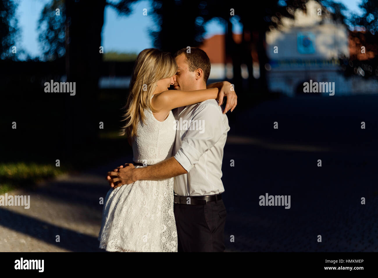 Young people embracing Stock Photo - Alamy