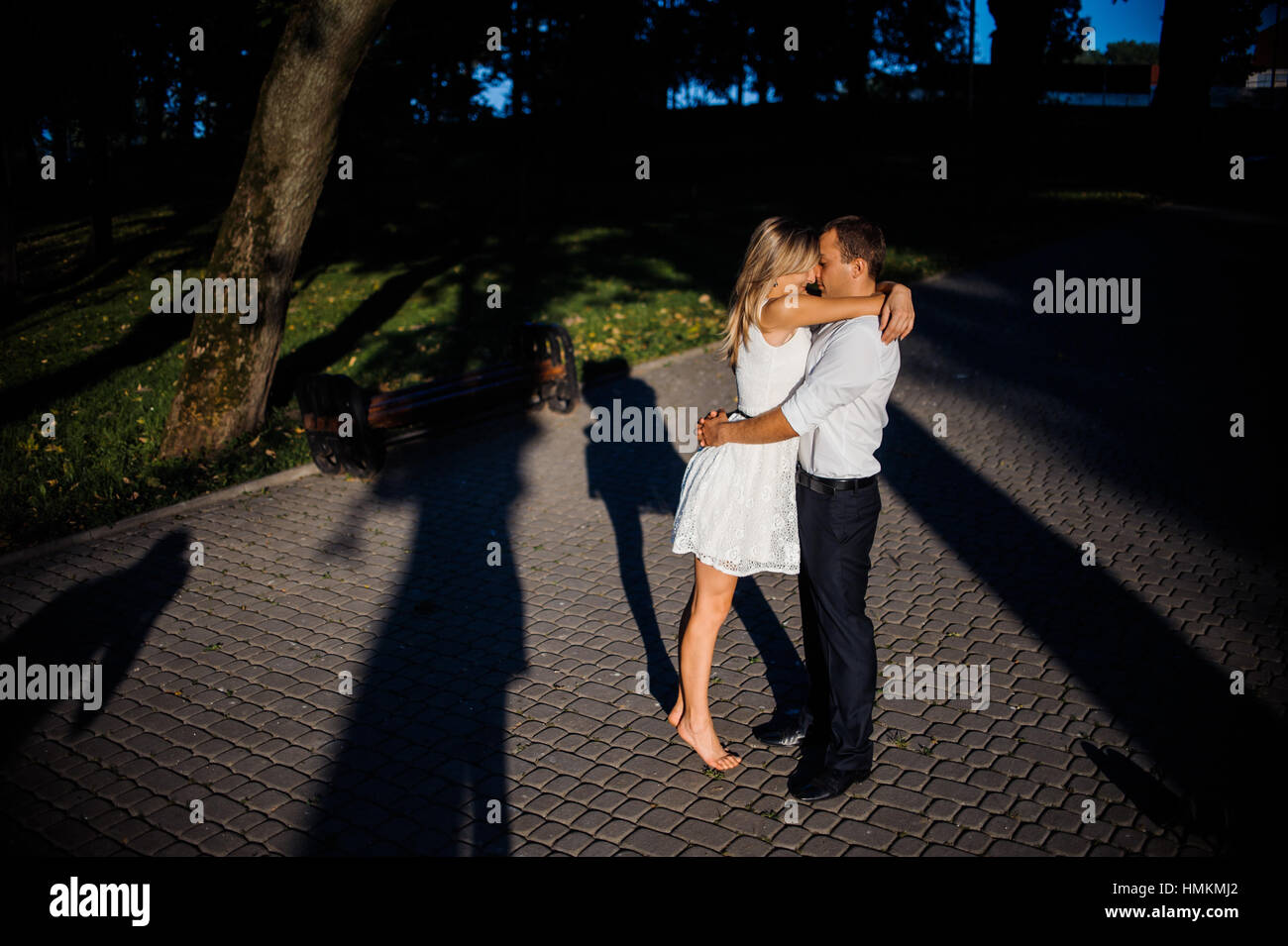 Young people embracing Stock Photo - Alamy