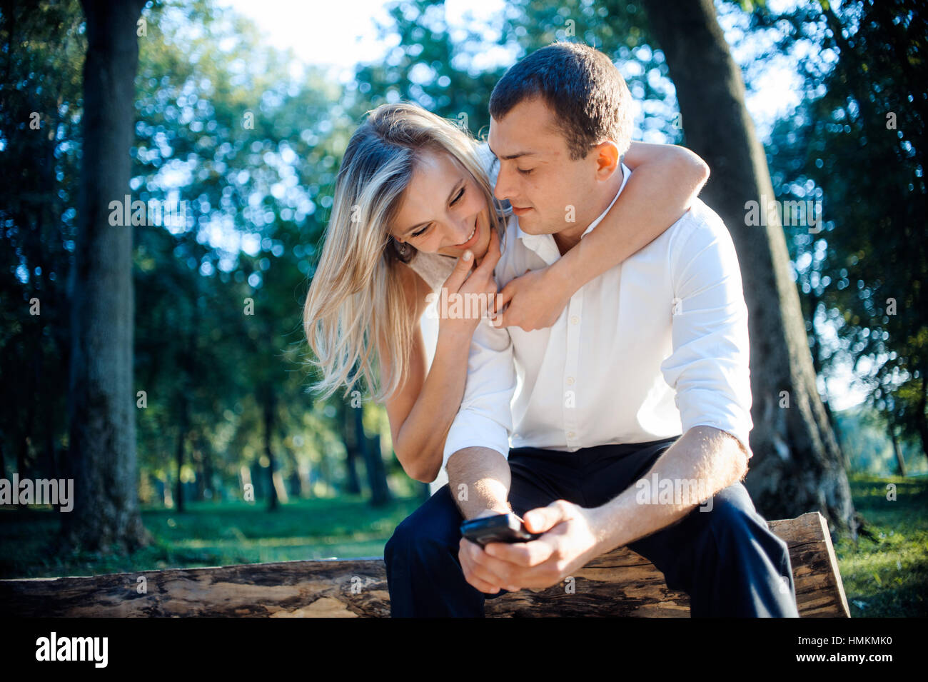 Young people embracing Stock Photo - Alamy