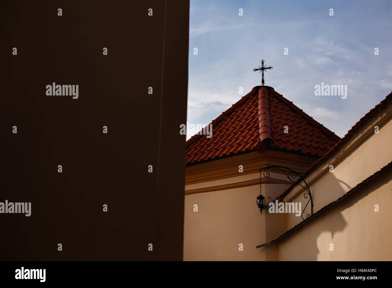 Christian symbol cross on the roof of catholic church Stock Photo - Alamy
