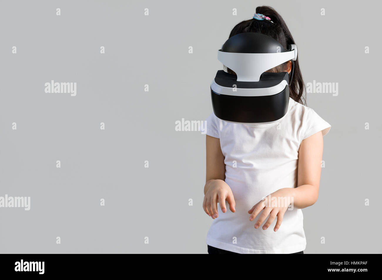 Studio shot of child with virtual reality, VR, headset, isolated on ...