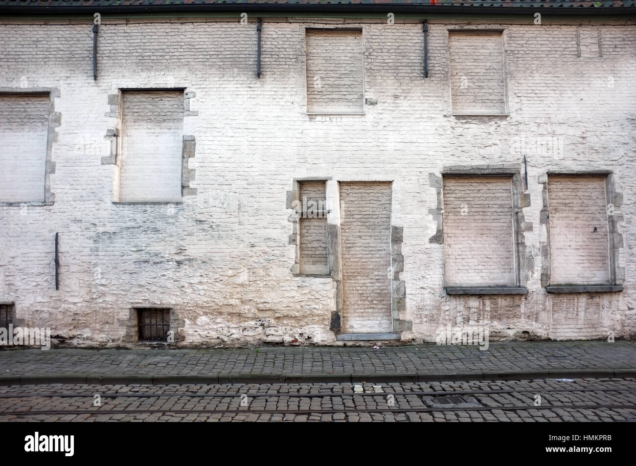 Building with the windows filled with bricks Stock Photo - Alamy