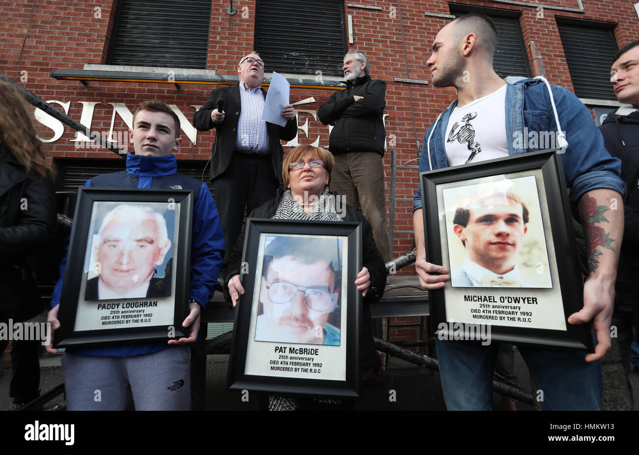 Sinn Fein's Fra McCann (left back) and leader Gerry Adams (right back ...