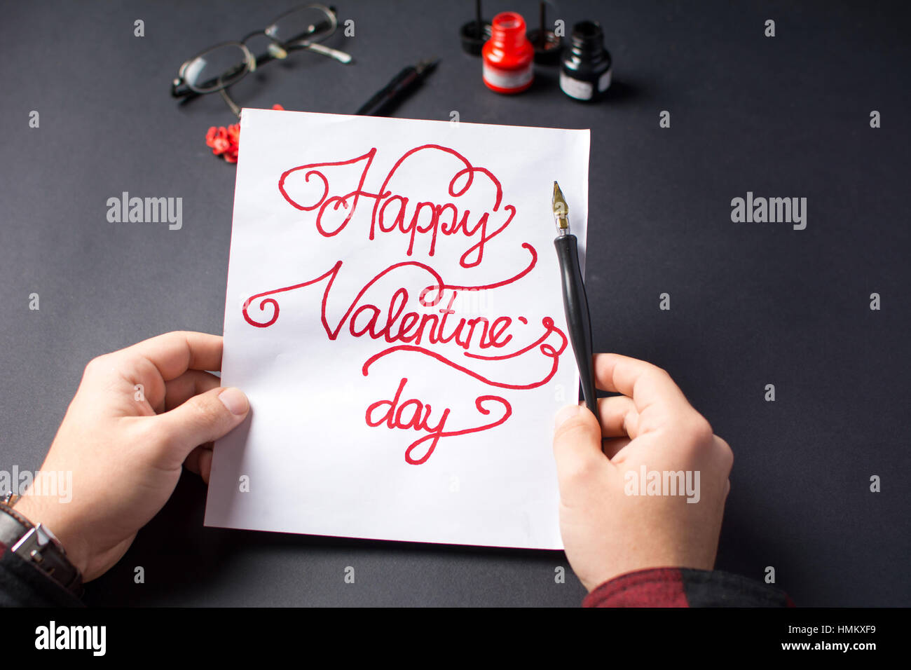 male hands writing a Valentine's day card calligraphy Stock Photo - Alamy