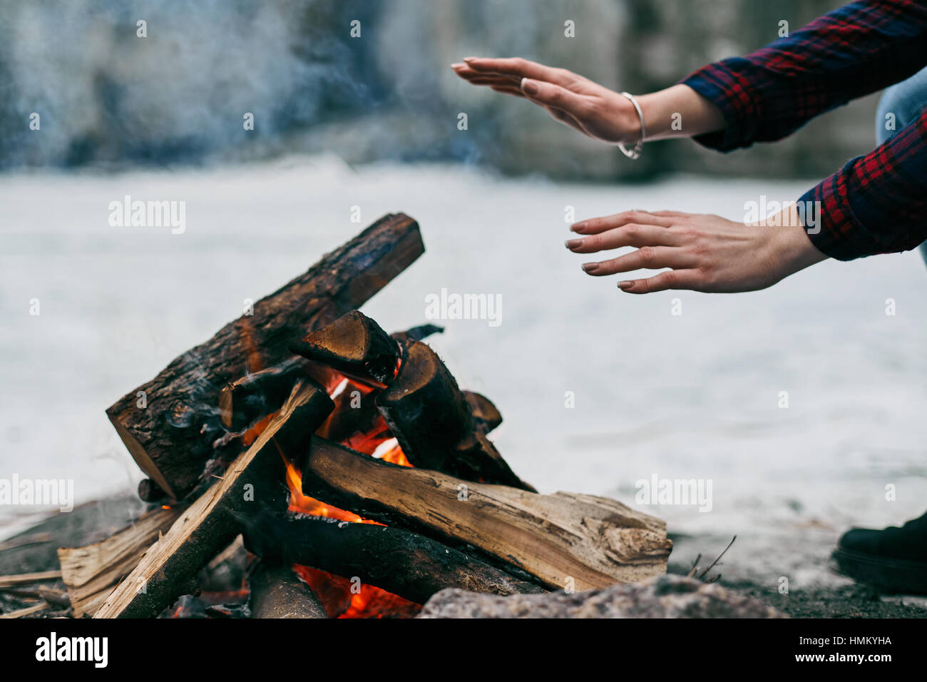 Woman warm hands near fire hi-res stock photography and images - Alamy