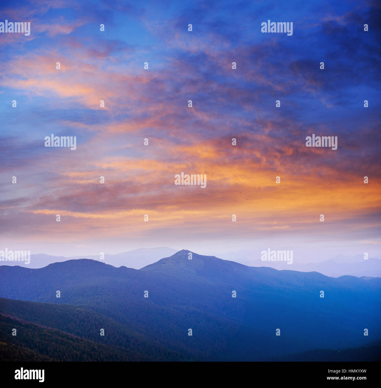 blue color of mountains during sunset Stock Photo - Alamy