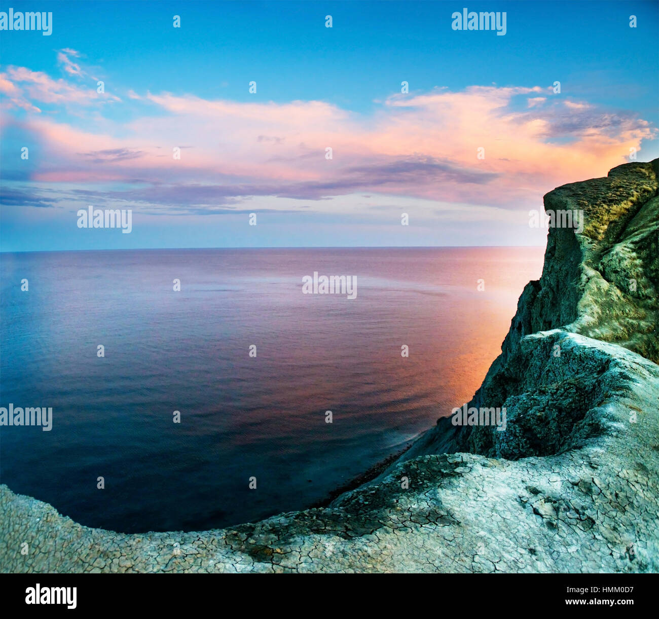 Rocks and sea. Dramatic scene Stock Photo - Alamy