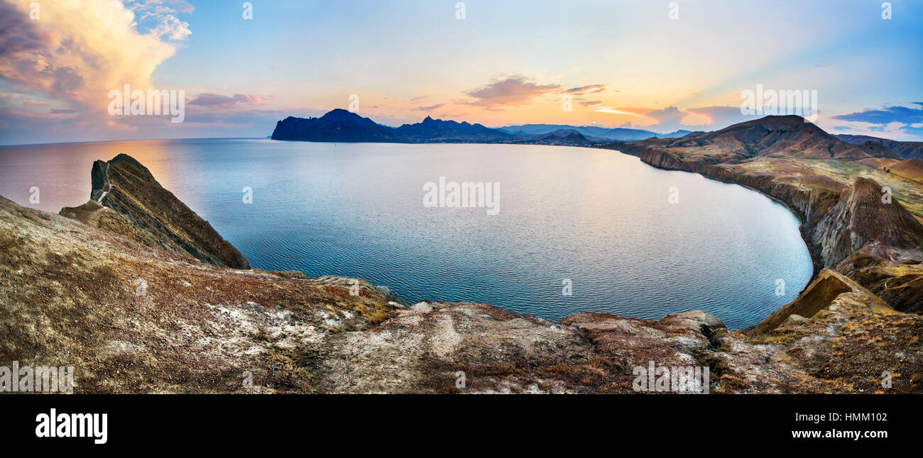 Rocks and sea. Dramatic scene Stock Photo - Alamy