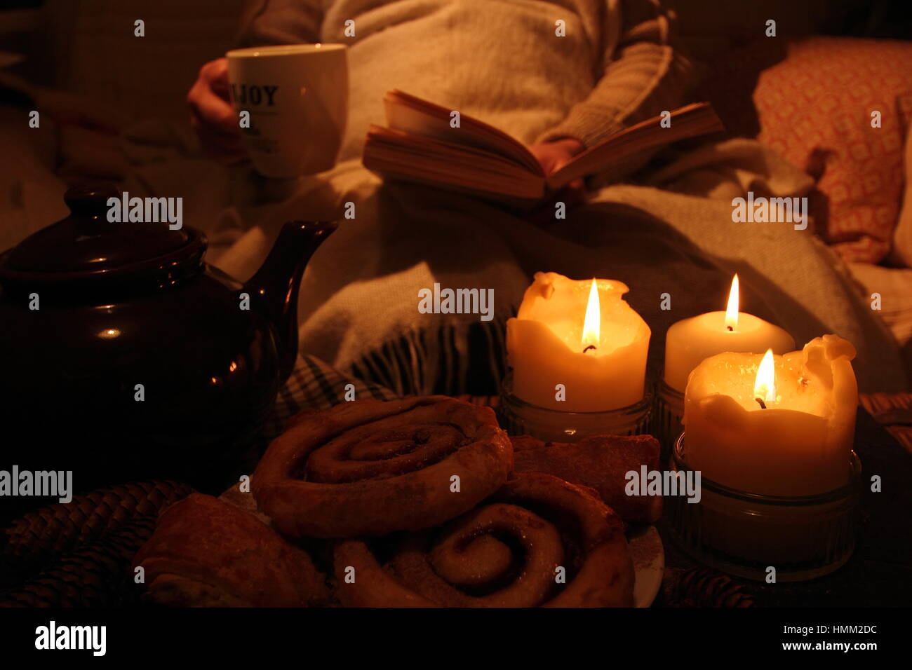 Relaxing on a winter evening by candlelight in a cosy, hygge inspired ...