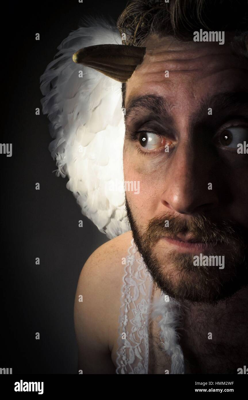 Fallen angel satan with feathered wings and moody lighting Stock Photo ...