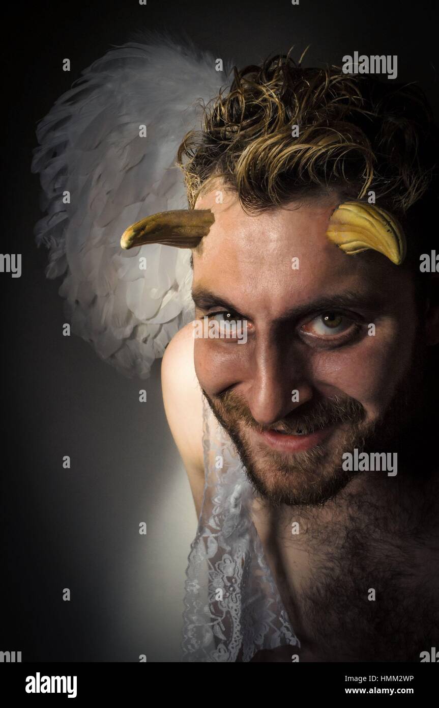 Fallen angel satan with feathered wings and moody lighting Stock Photo ...