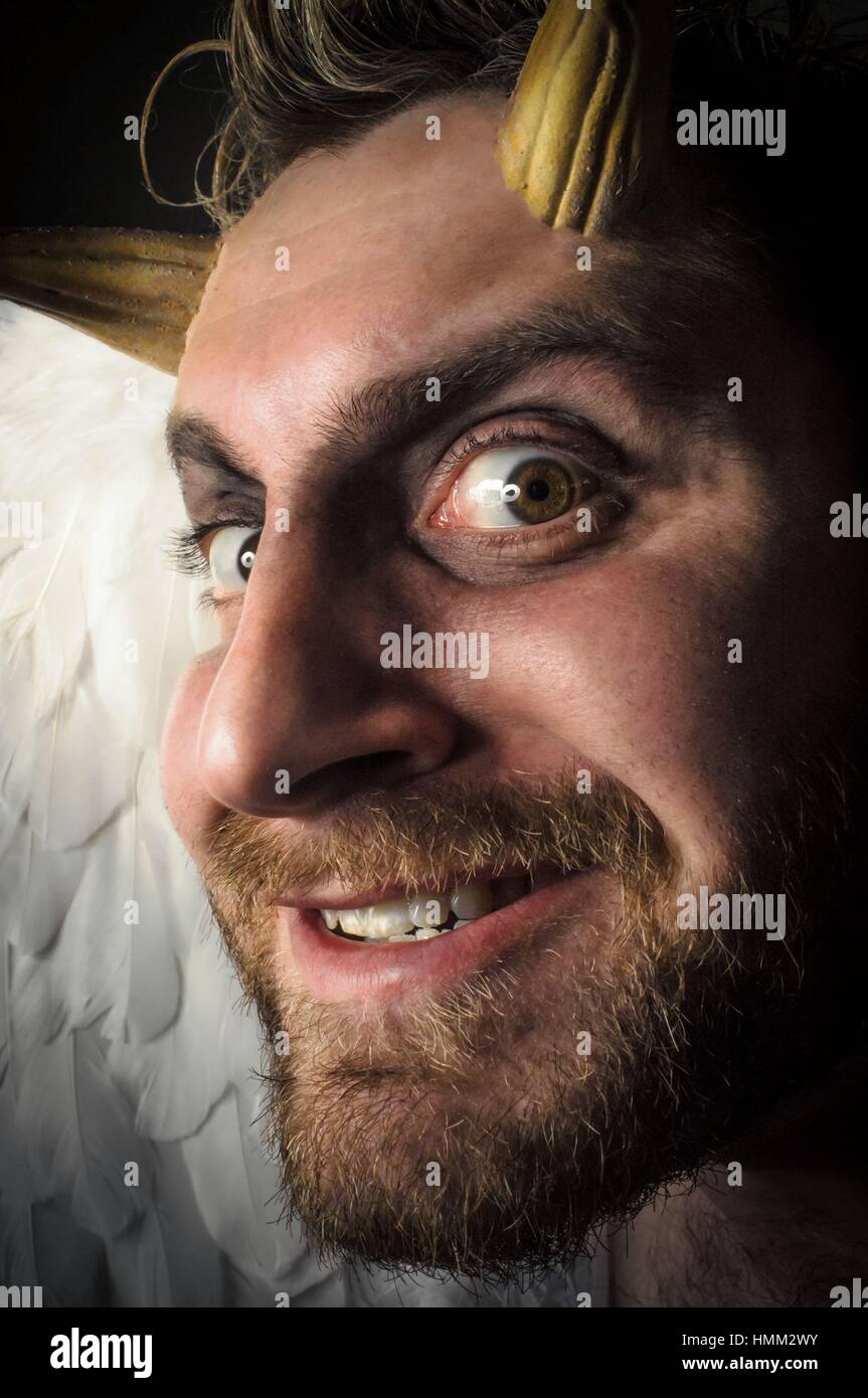 Fallen angel satan with feathered wings and moody lighting Stock Photo ...