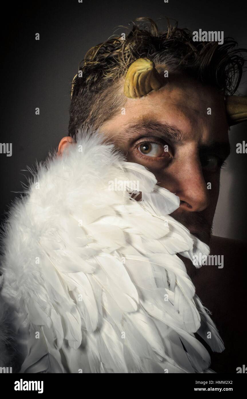 Fallen angel satan with feathered wings and moody lighting Stock Photo ...